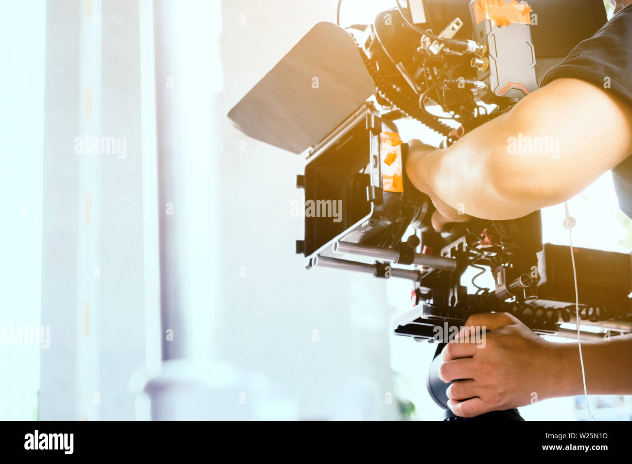 Filming with professional camera background Stock Photo - Alamy