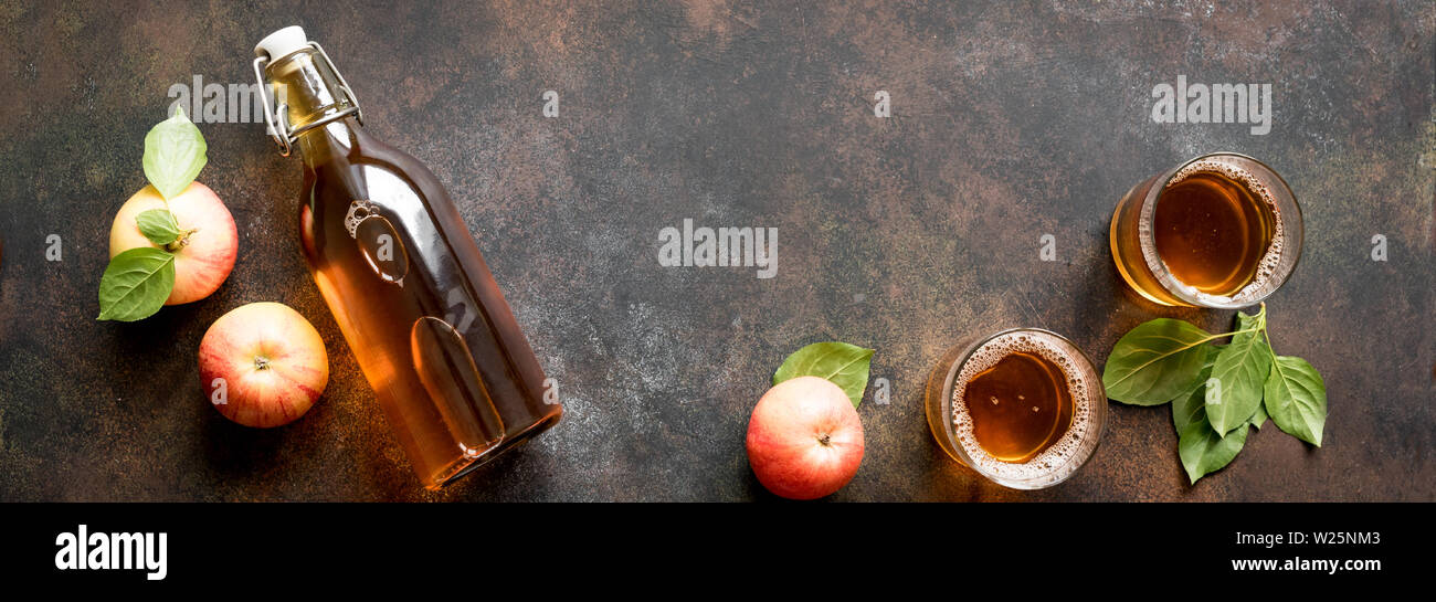 Apple cider drink or fermented fruit drink and organic apples on dark ...