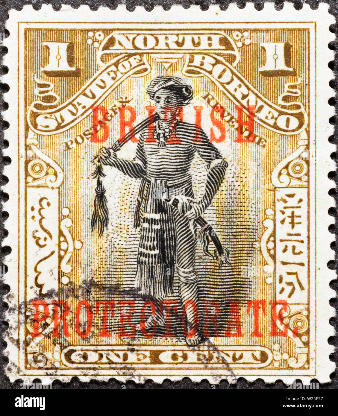 Indigenous man on old postage stamp of Borneo Stock Photo - Alamy