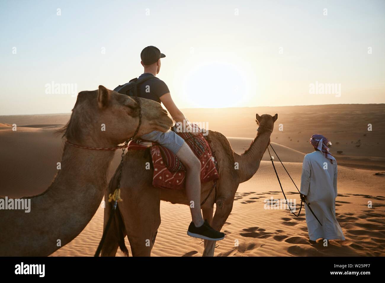 Men riding camel hi-res stock photography and images - Alamy