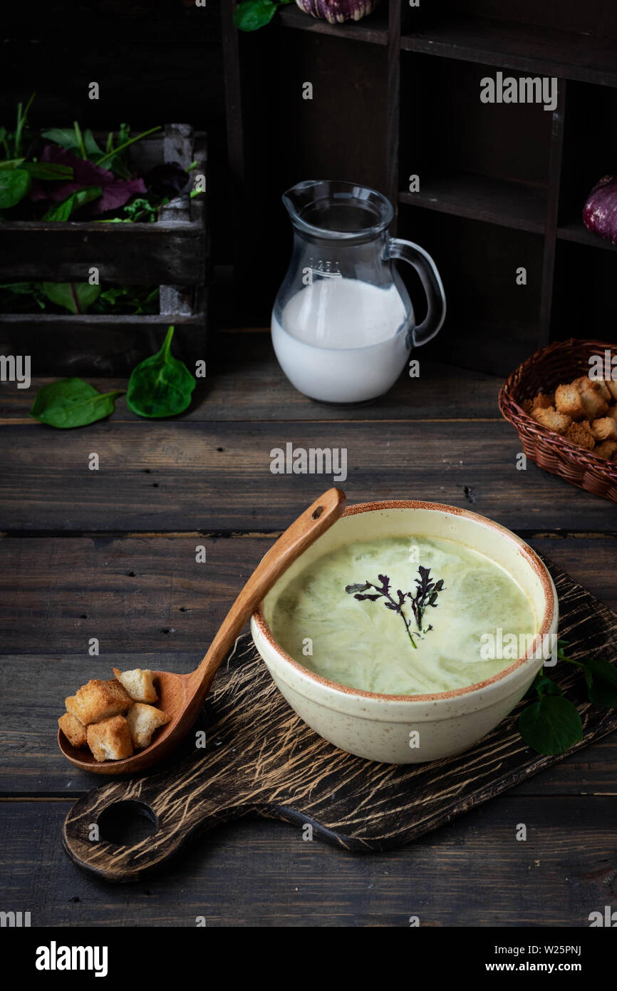 Creamy soup puree with spinach on a dark background Stock Photo - Alamy