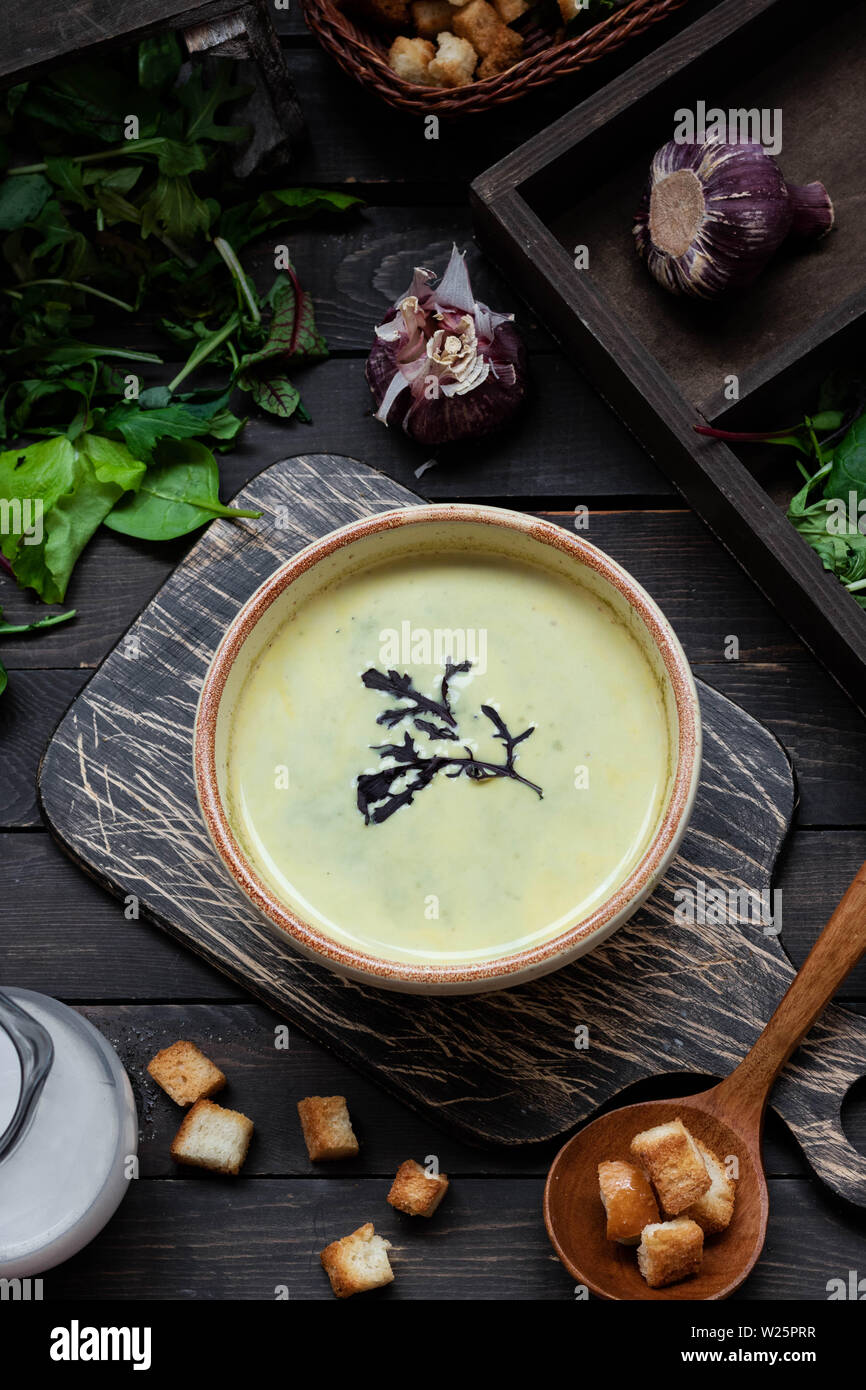 Creamy soup puree with spinach on a dark background Stock Photo - Alamy