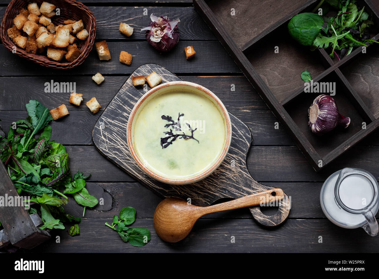 Creamy soup puree with spinach on a dark background Stock Photo - Alamy