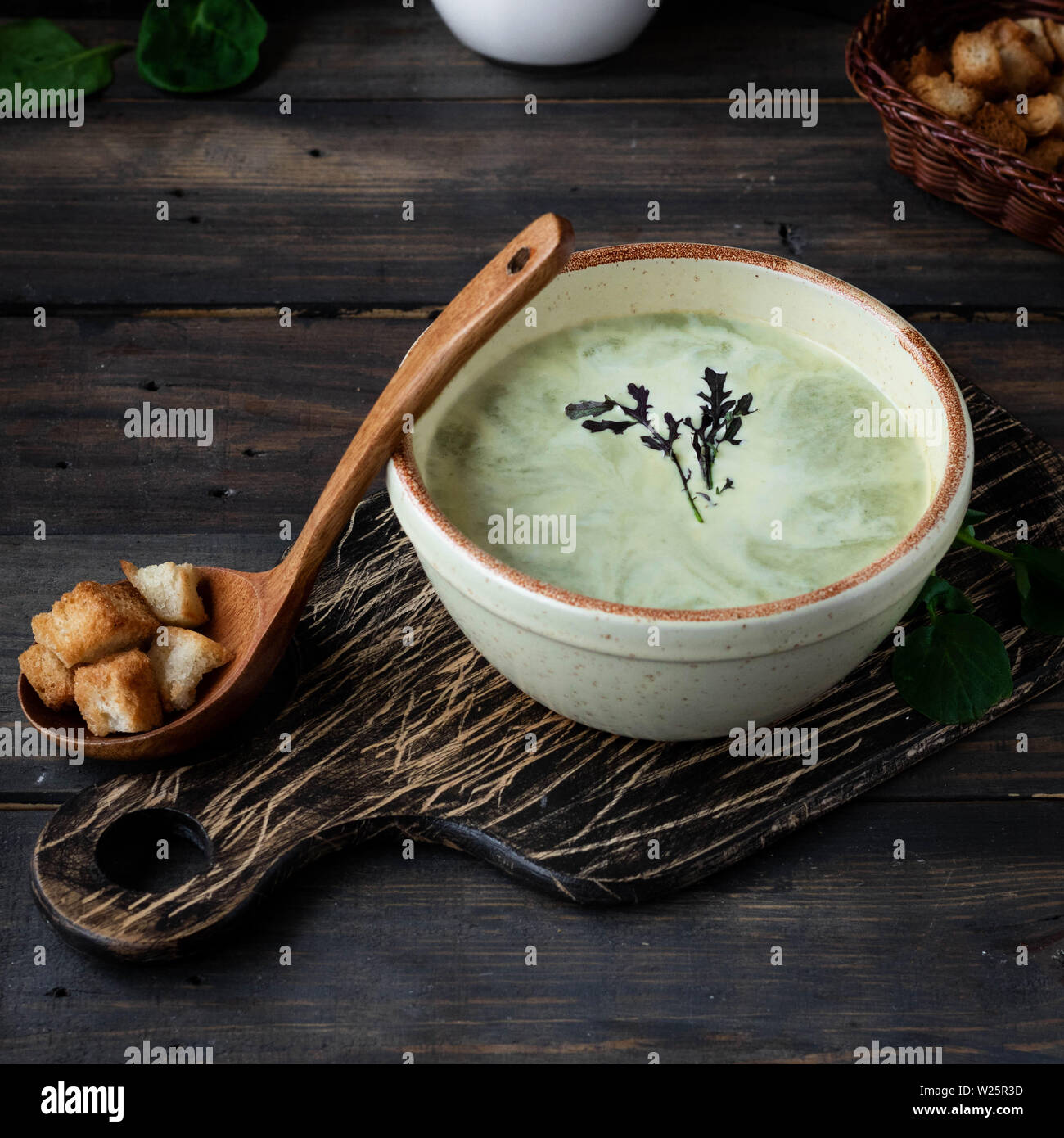 Creamy soup puree with spinach on a dark background Stock Photo - Alamy