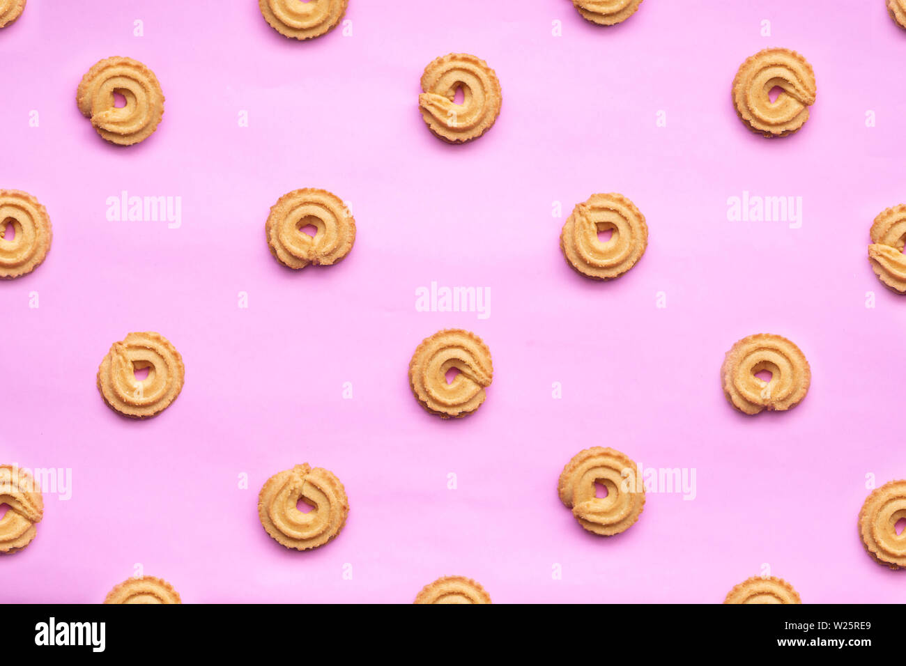 round Danish butter cookie isolated on pink background. cookies pattern ...