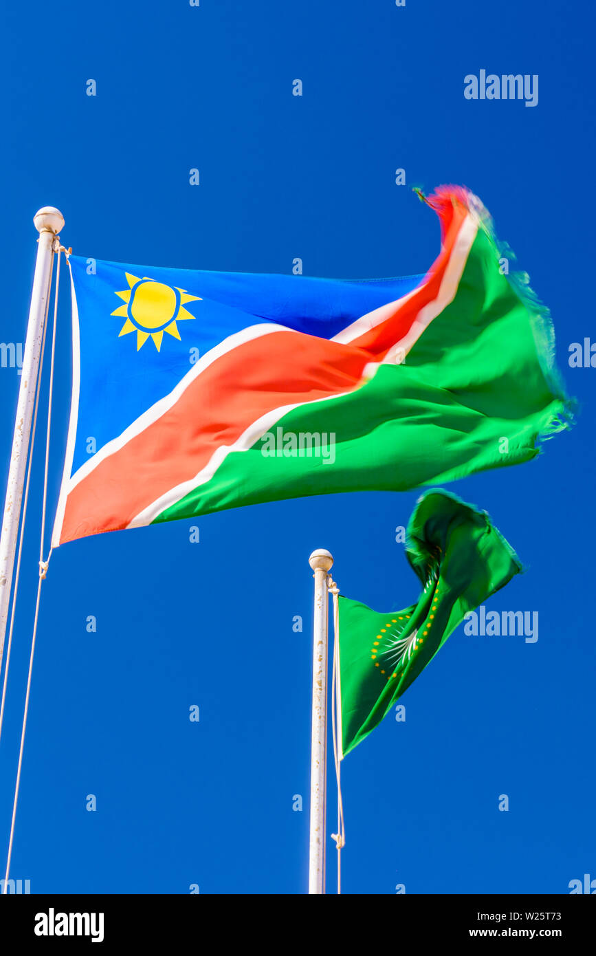 Blue sky with a white sun flag hi-res stock photography and images - Alamy