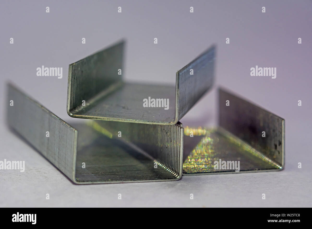 Stack of metal staples isolated from white background Stock Photo - Alamy