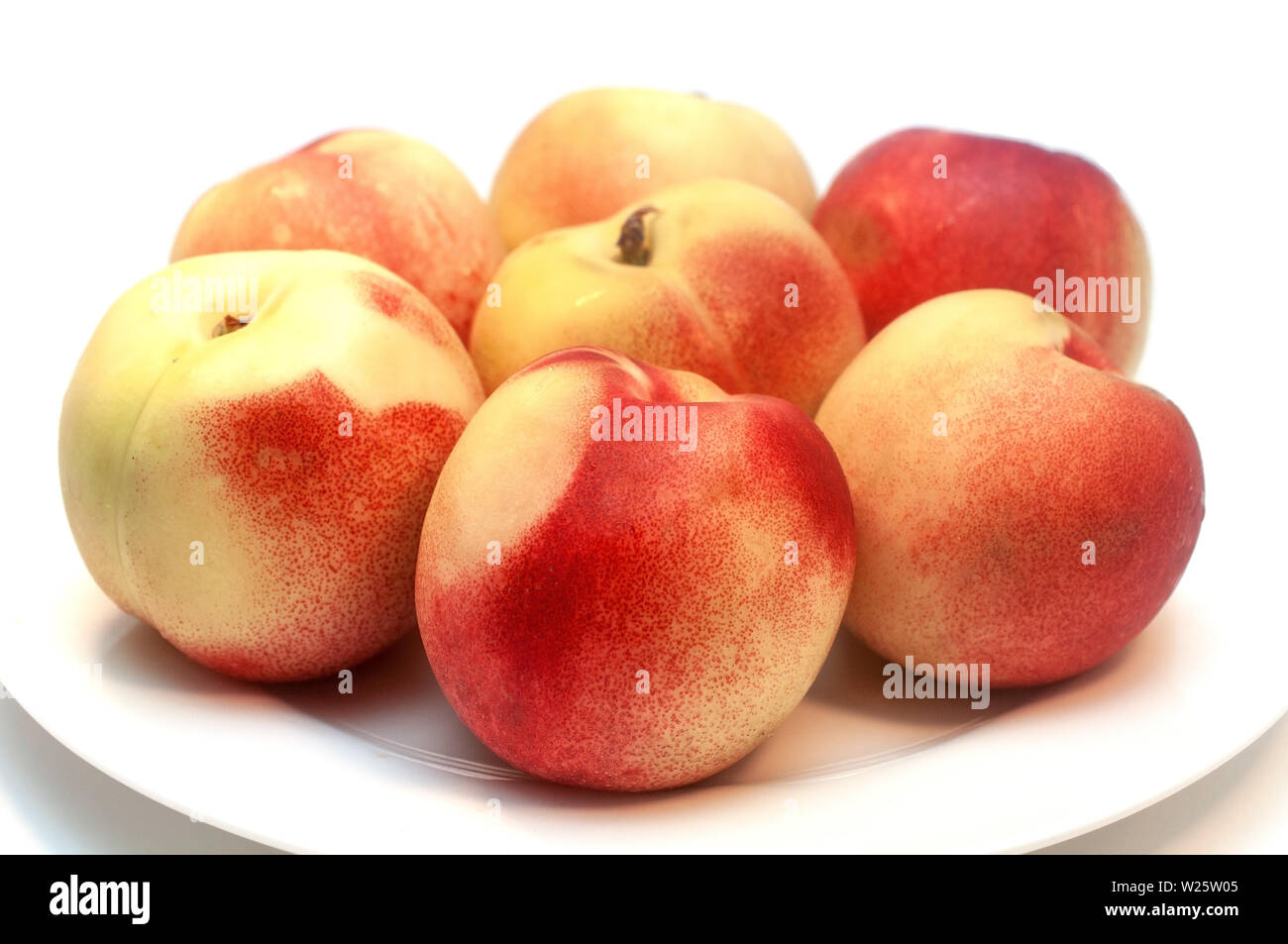 Fresh nectarines isolated on white background Stock Photo - Alamy