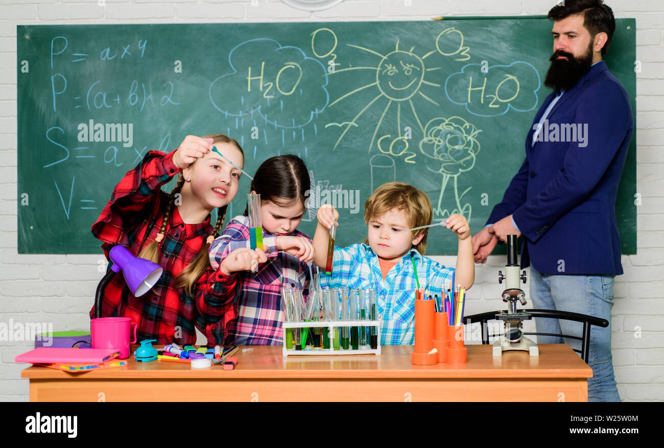 Taking closer look. chemistry lab. back to school. happy children ...