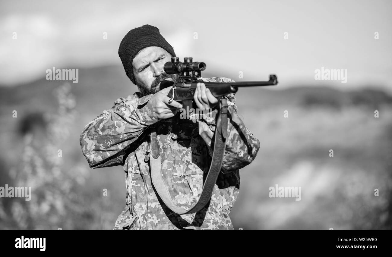 Man brutal gamekeeper nature background. Bearded hunter spend leisure ...