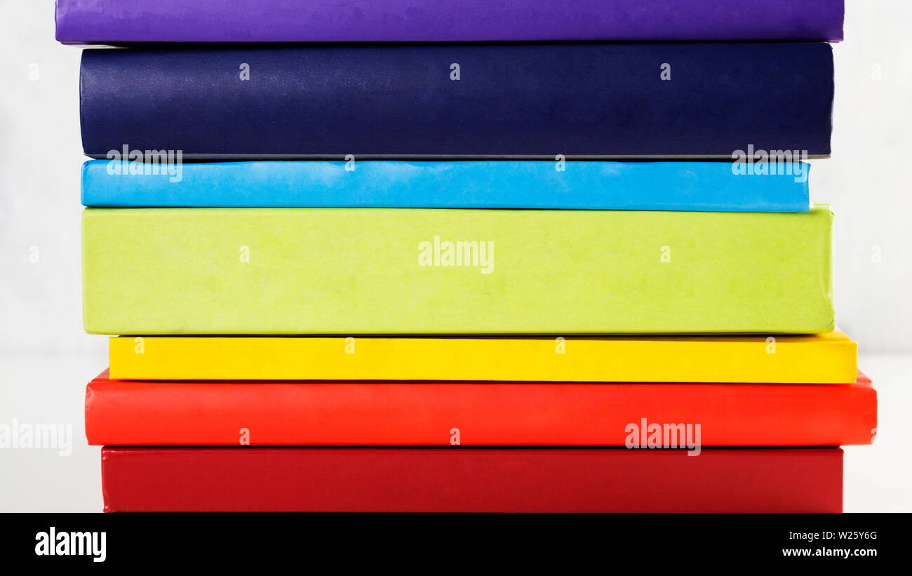 Stack of colorful rainbow books on white background Stock Photo - Alamy