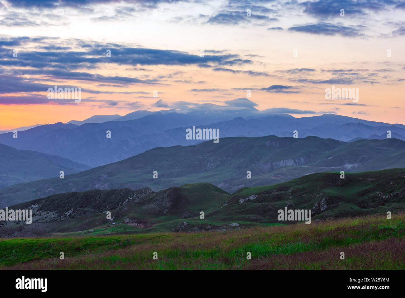 Colorful sunset in the mountains Stock Photo - Alamy