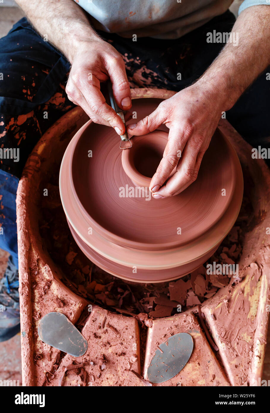 Professional potter making bowl in pottery workshop, studio Stock Photo ...