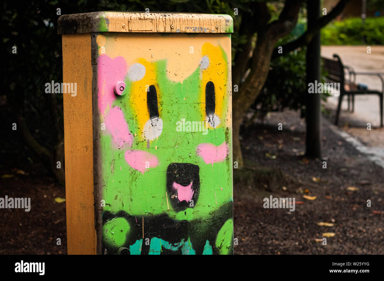 An Electric box with graffiti that look like a smiling happy face Stock ...