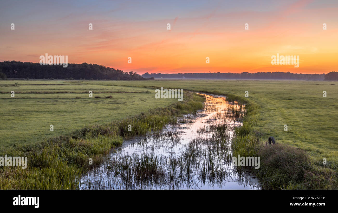 Sunset Landscape of lowland river Koningsdiep in the Netherlands Stock ...