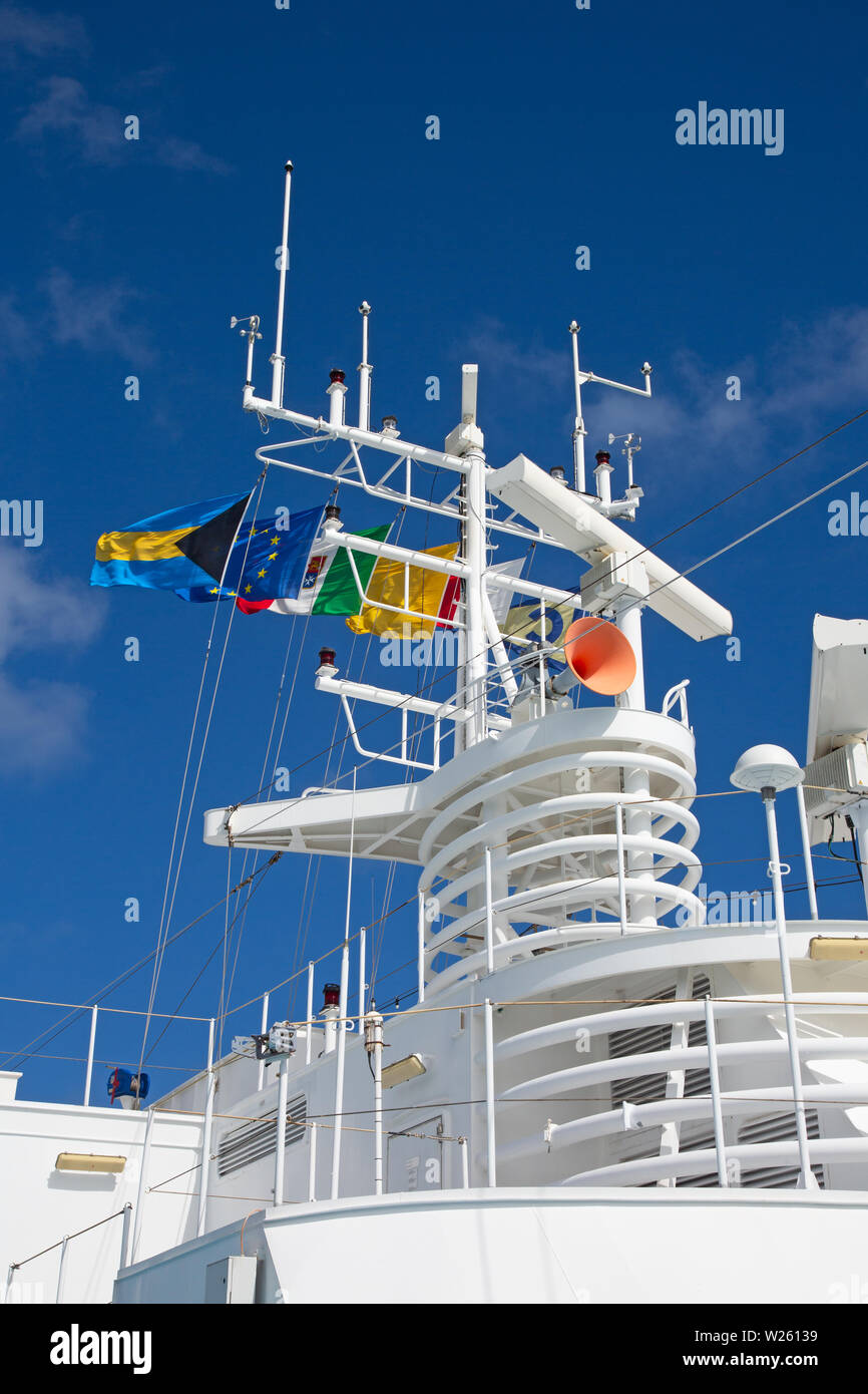 Navigation equipment and masts of cruise ship decorated with flags ...