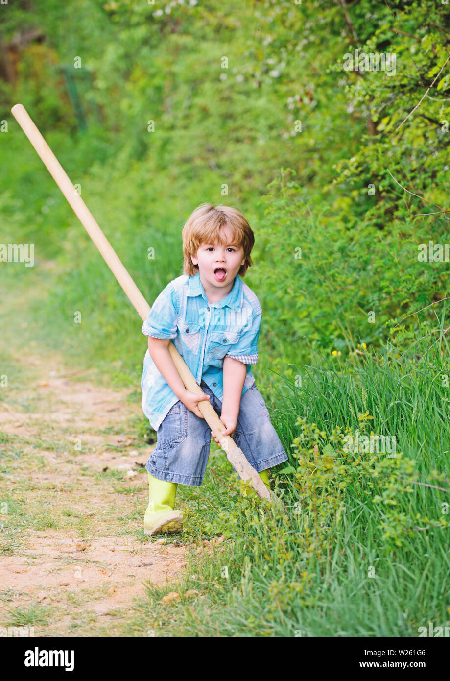 I want to find treasures. Little boy with shovel looking for treasures ...
