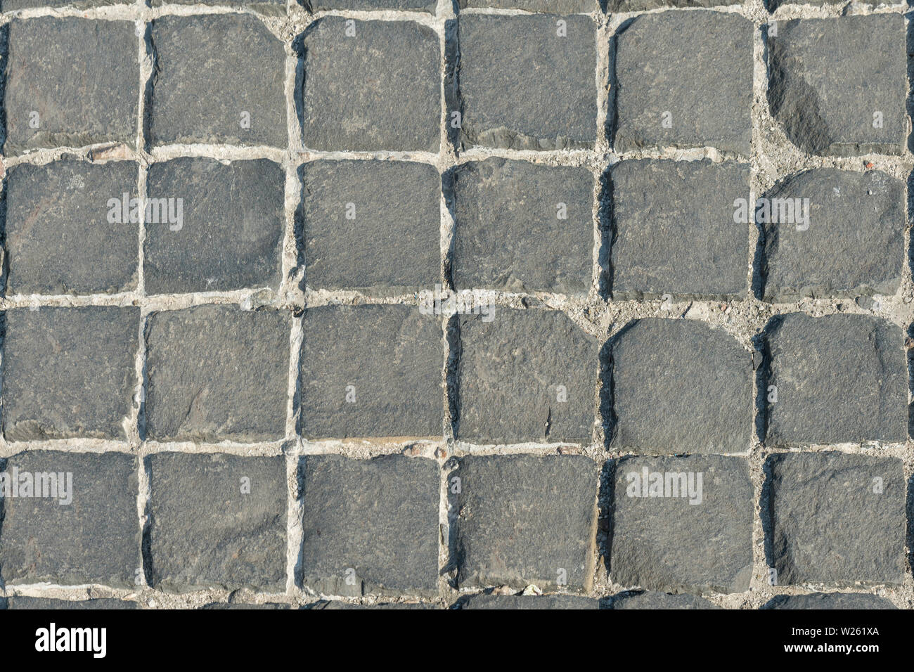 The road of square stones. Background of gray old stone Stock Photo - Alamy