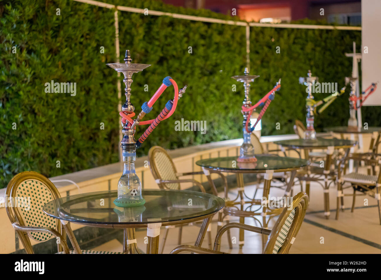 hookah outdoor. Hookahs on the tables in the cafe. Several hookahs ...
