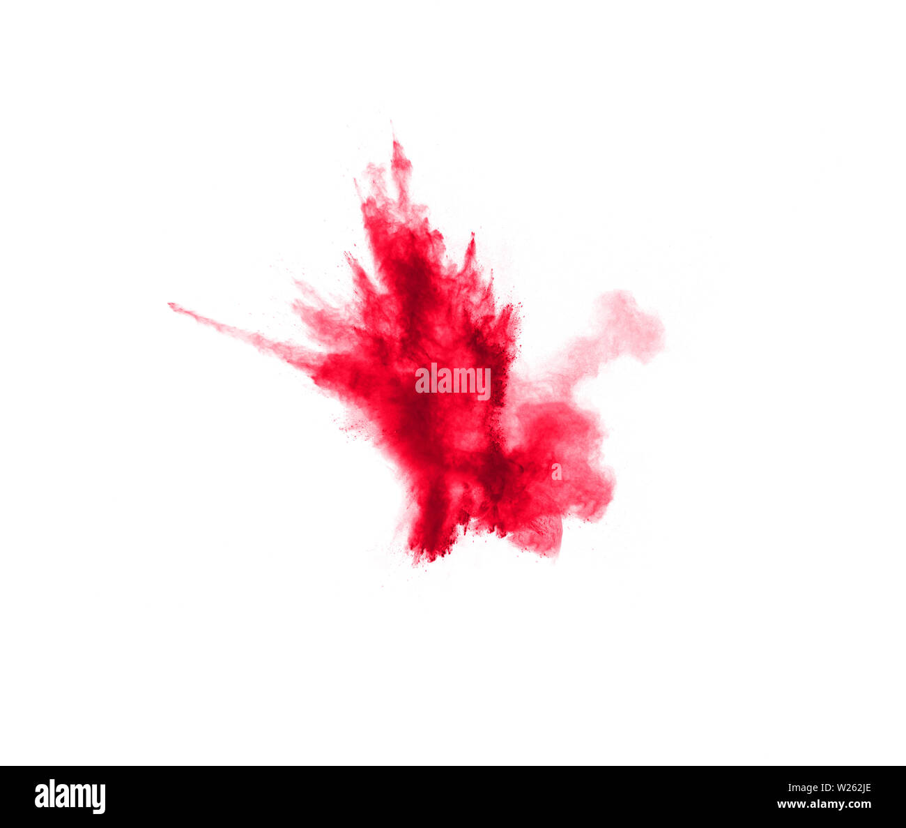 Abstract red dust splattered on white background. Red powder explosion ...