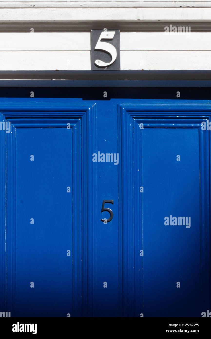 House number 5 with the five over the door on a white door frame Stock ...