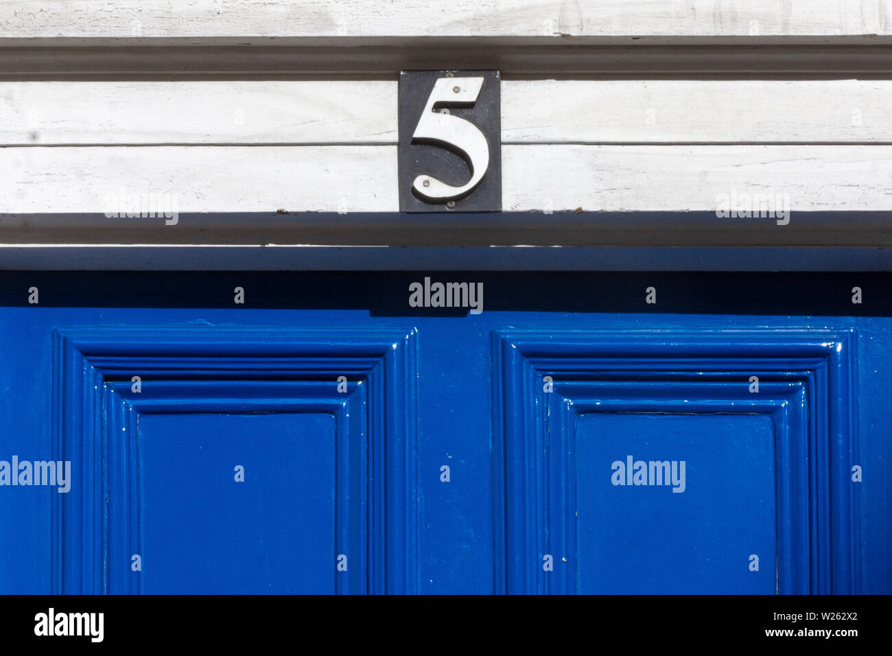 House number 5 with the five over the door on a white door frame Stock ...