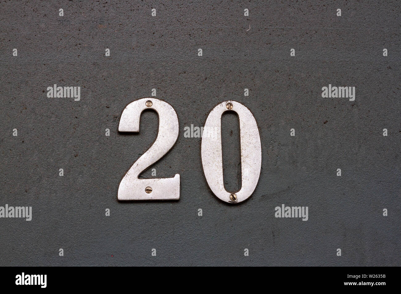 House number 20 with the twenty in silver metal digits on a black ... House number 20 with the twenty in silver metal digits on a black ...