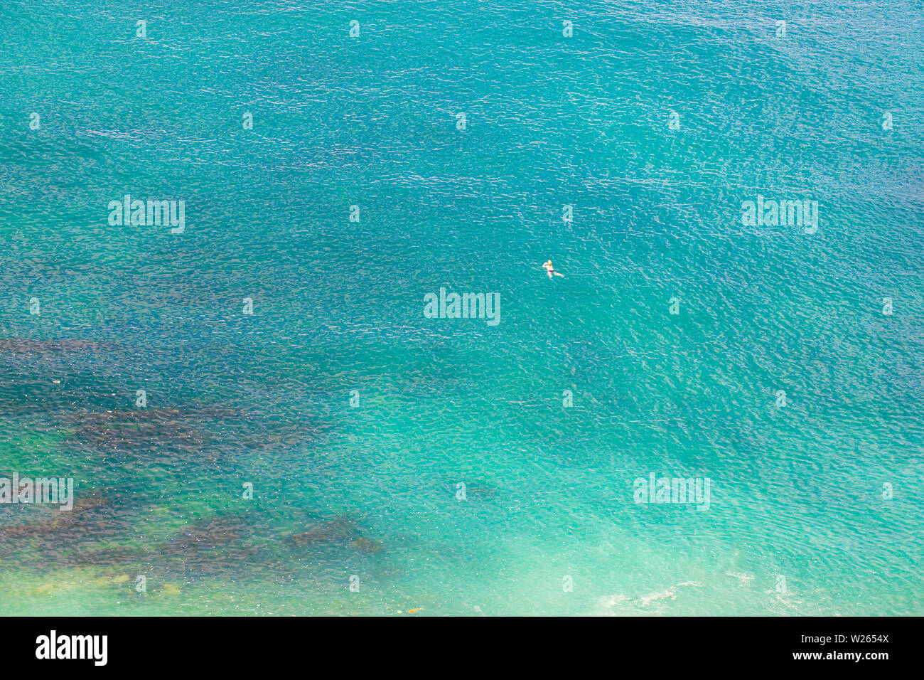 Young men swimming in the blue sea. Top view Stock Photo - Alamy
