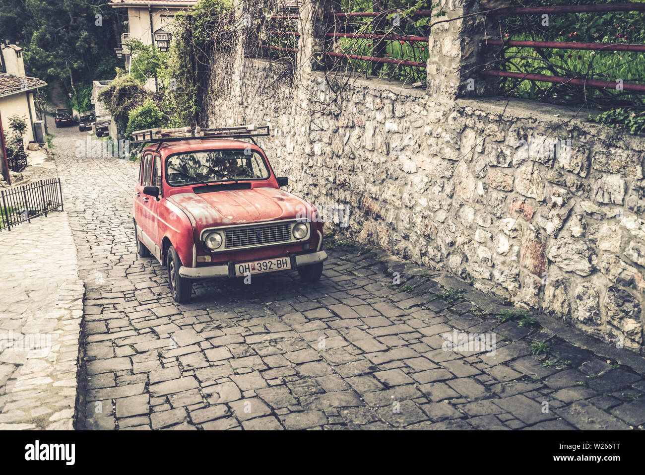 Car driving slowly street hi-res stock photography and images - Alamy