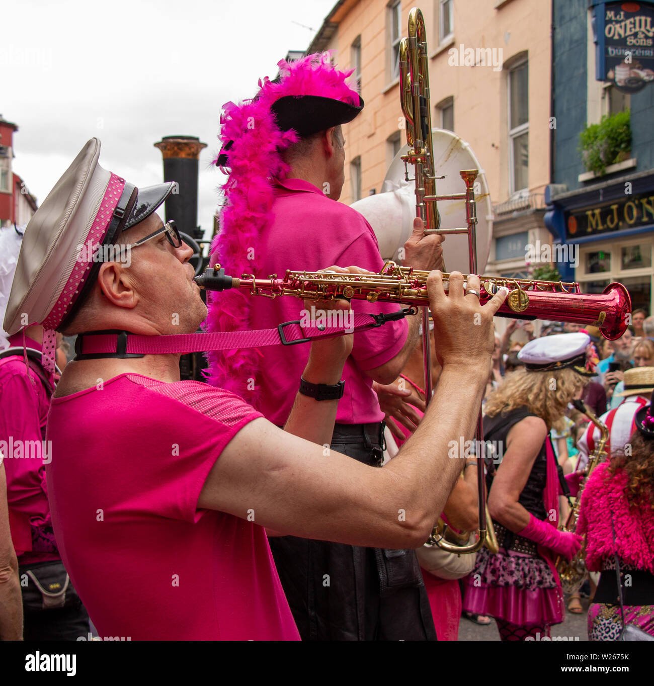 Jazz band street performance wearing pink cloths playing in Clonakilty ...