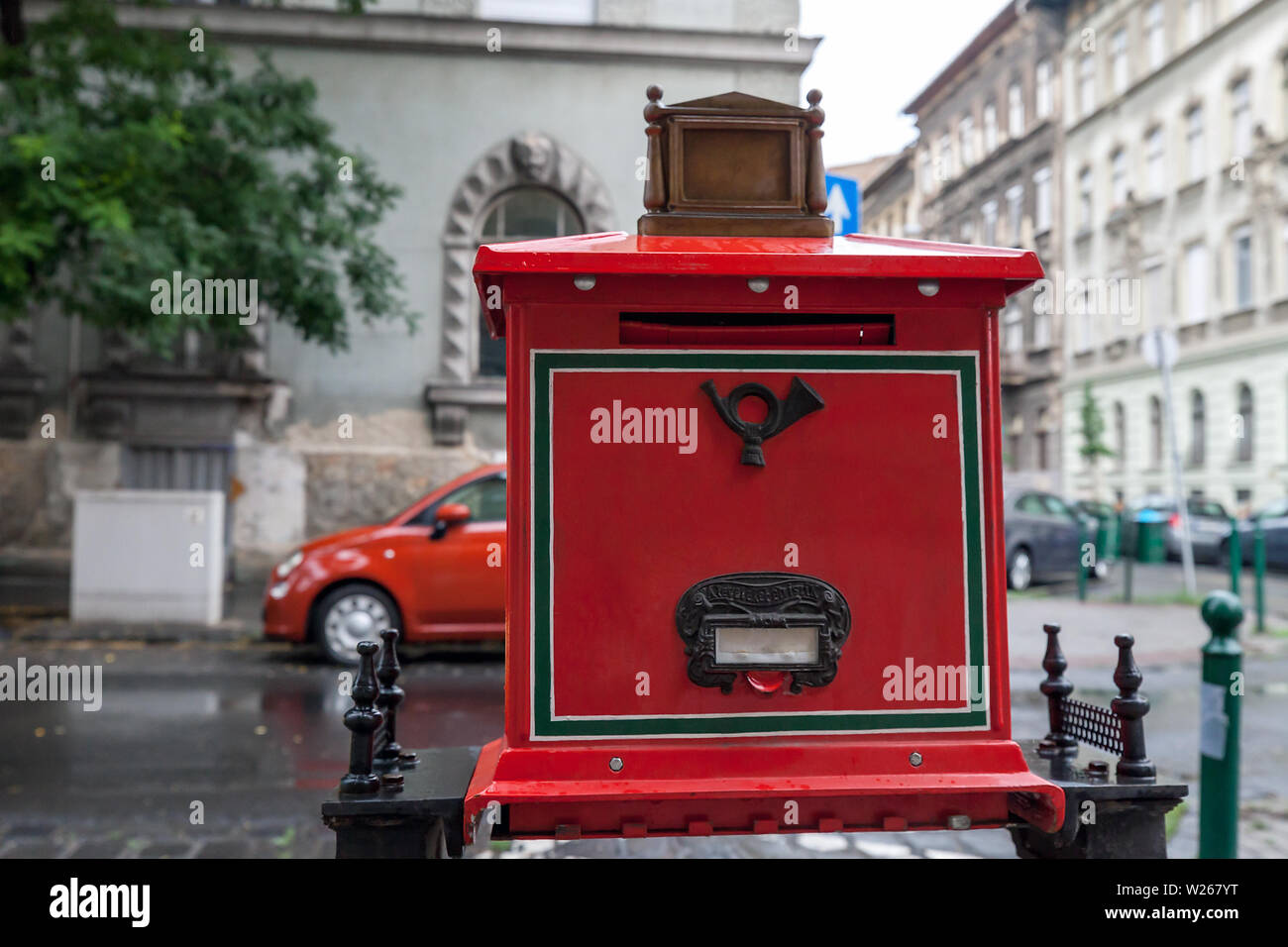 Red mailbox on city street in Budapest, Hungary Stock Photo - Alamy