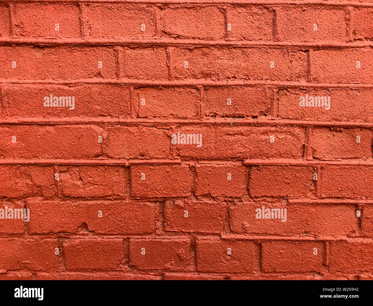 Red paint brick wall. Studio Photo Stock Photo - Alamy