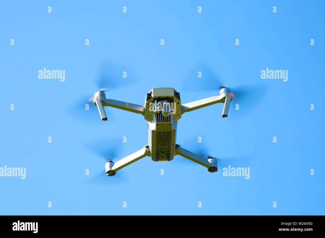 Drone in the blue sky Stock Photo - Alamy