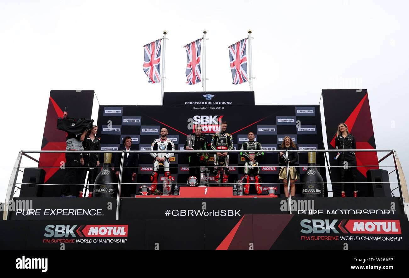 Race Winner Jonathan Rae (centre) on the podium with runner up Tom ...