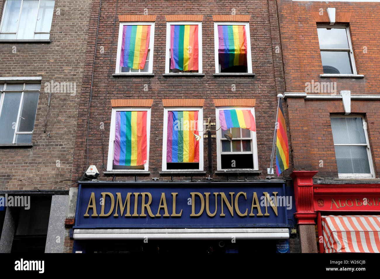 The raibow flags displayed above Admiral Duncan pub in Soho, London ...