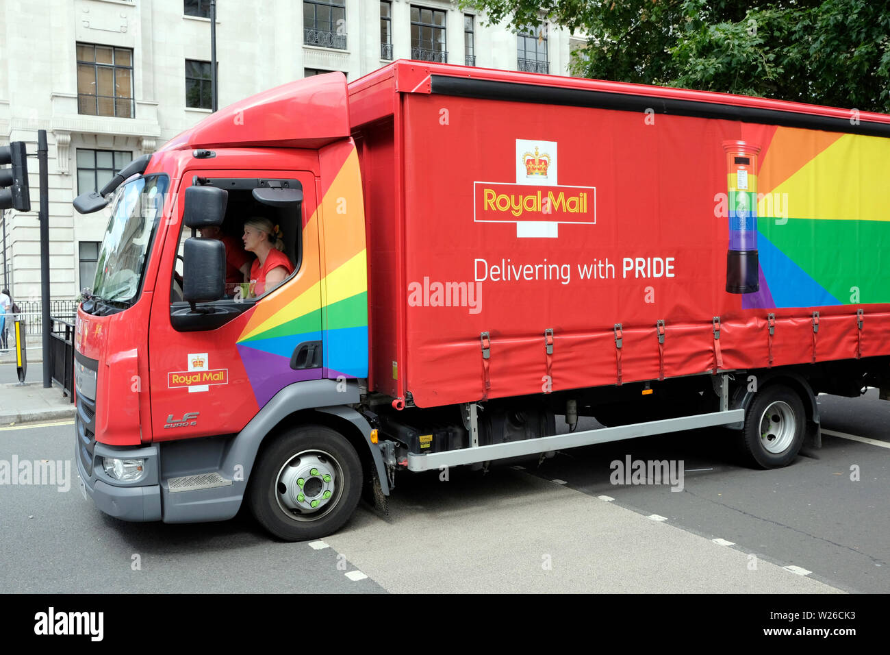 A royal mail delivery lorry painted in raibow colours Stock Photo - Alamy