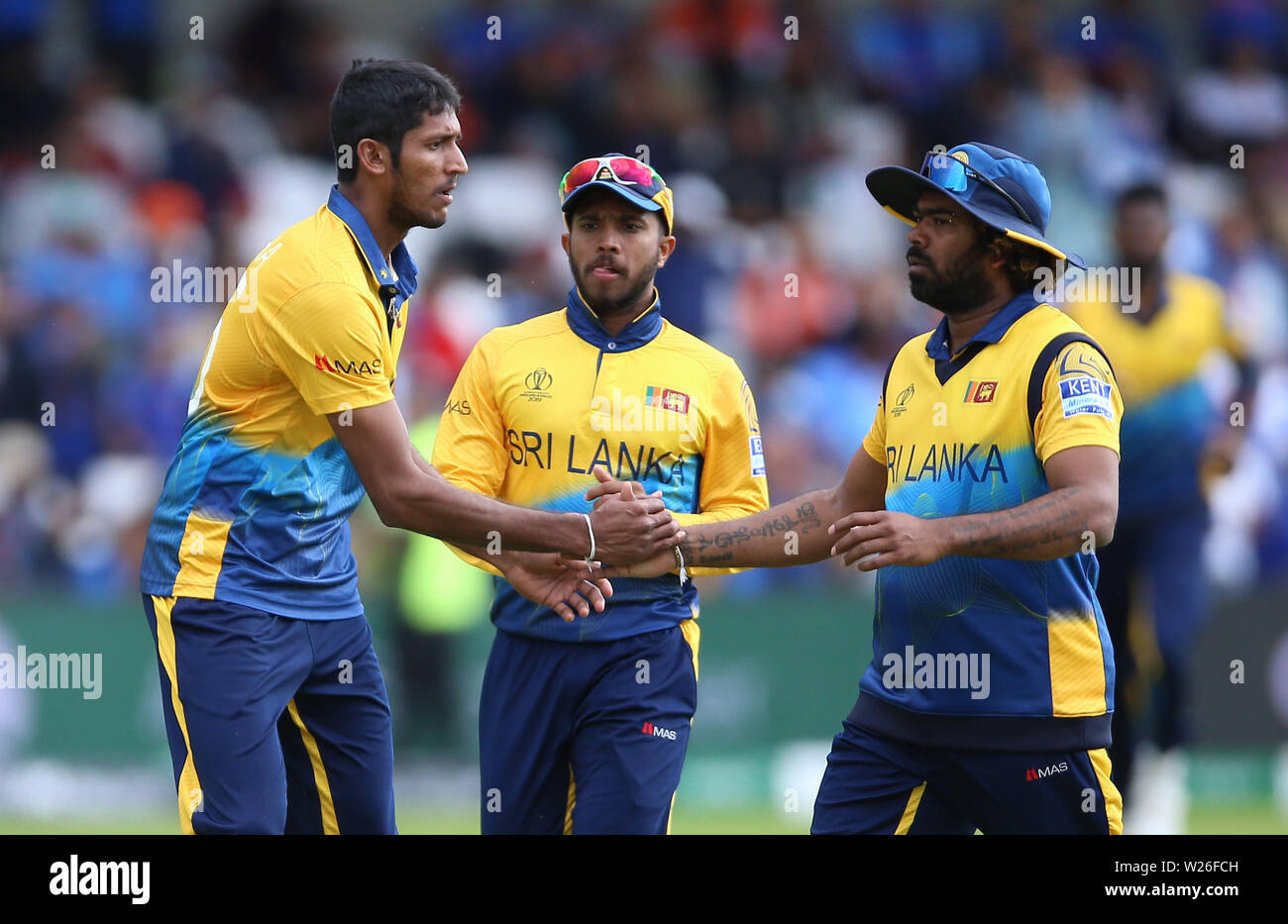 Sri Lanka's Kasun Rajitha celebrates the wicket of India's Rohit Sharma ...
