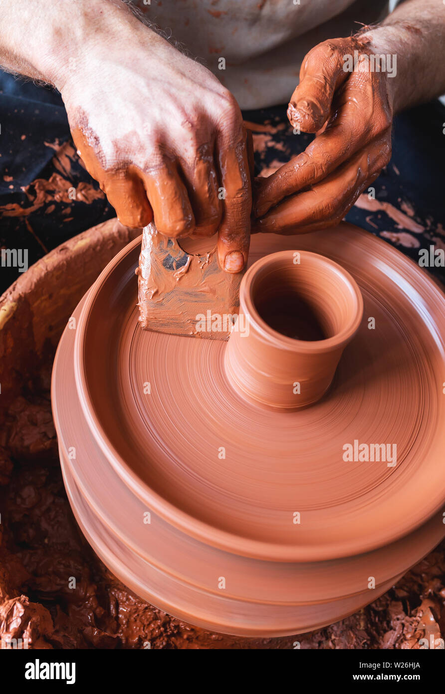 Professional potter making bowl in pottery workshop, studio Stock Photo ...