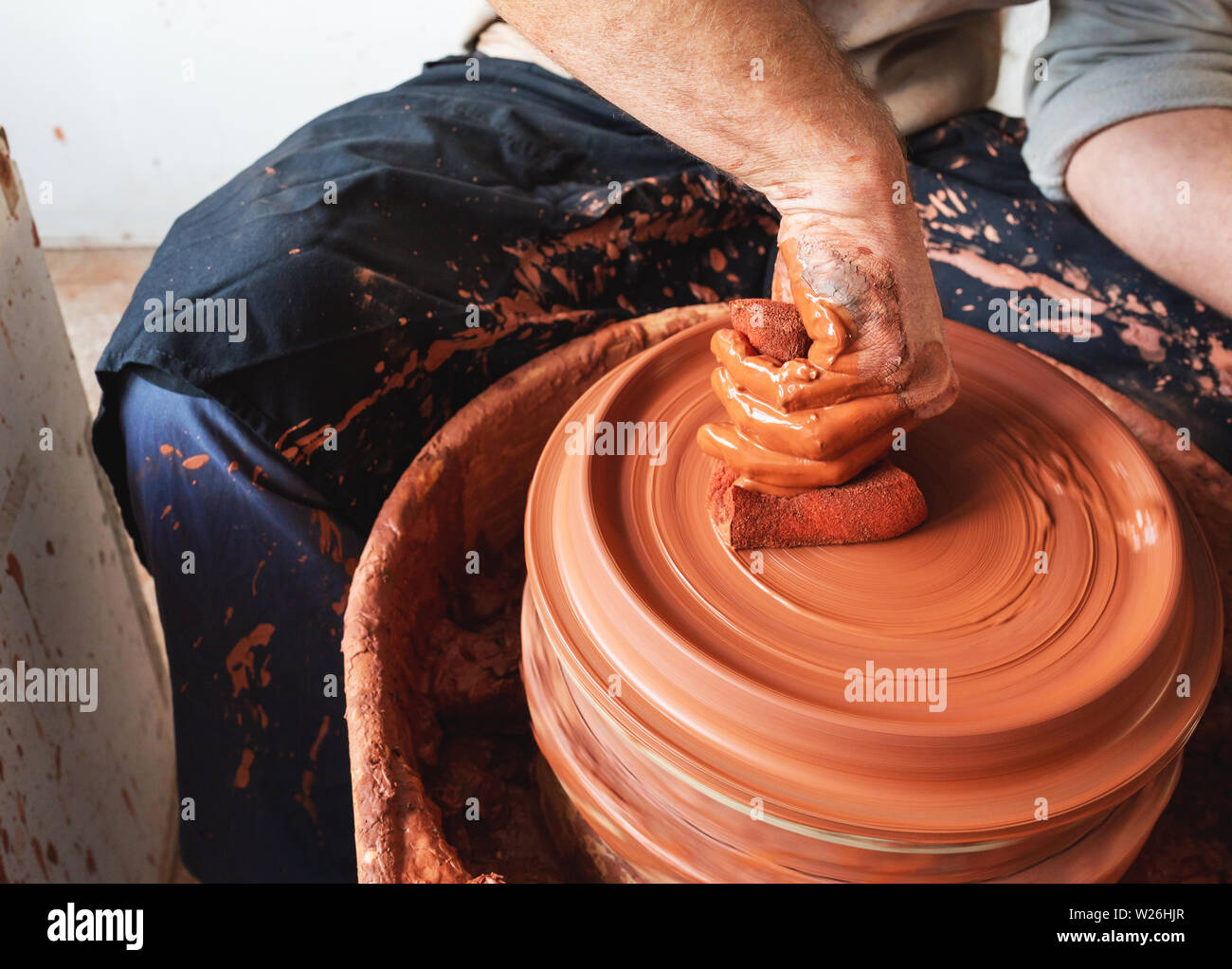 Professional potter making bowl in pottery workshop, studio Stock Photo ...