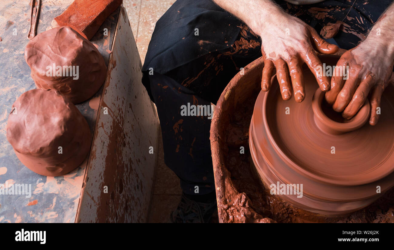Professional potter making bowl in pottery workshop, studio Stock Photo ...