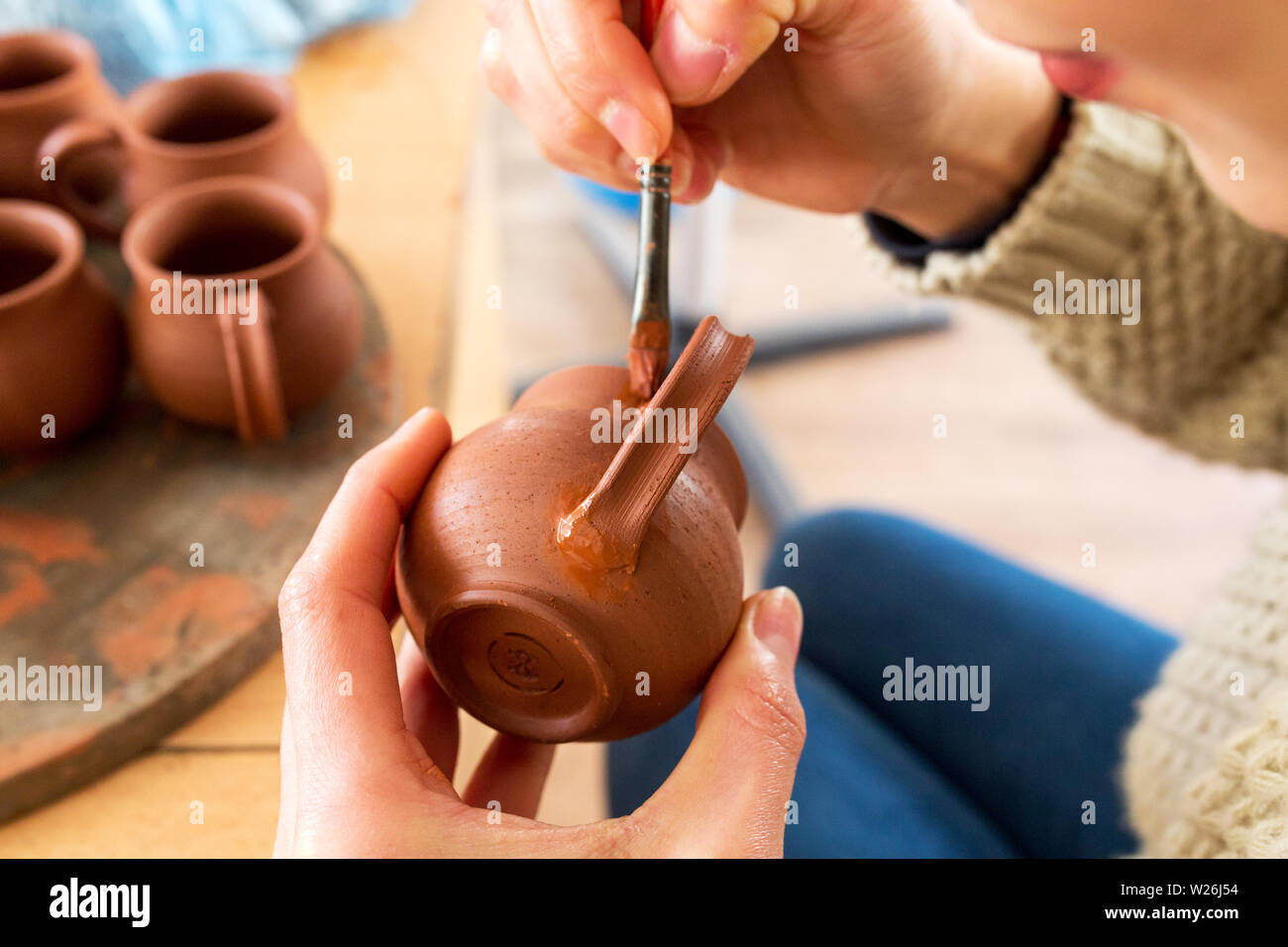 A pottery artist crafting a ceramic cup Stock Photo - Alamy