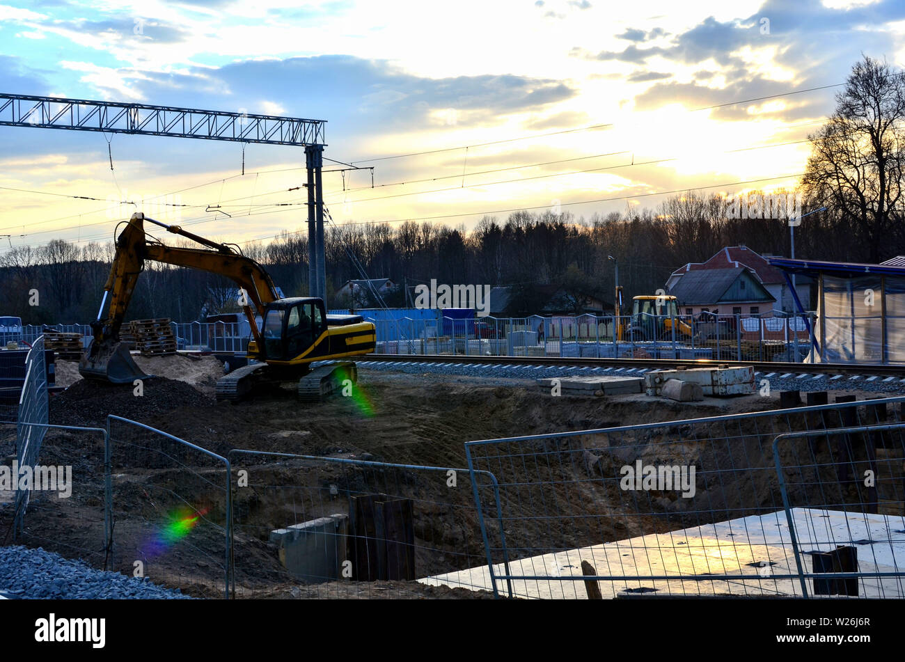 Excavator machine working on railway. Construction of the underpass ...