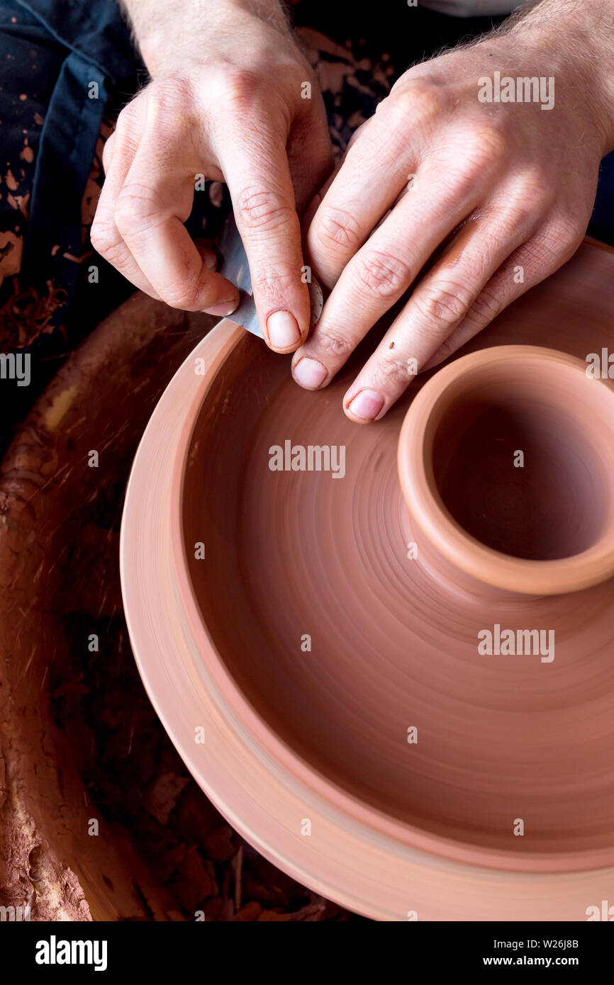 Professional potter making bowl in pottery workshop, studio Stock Photo ...