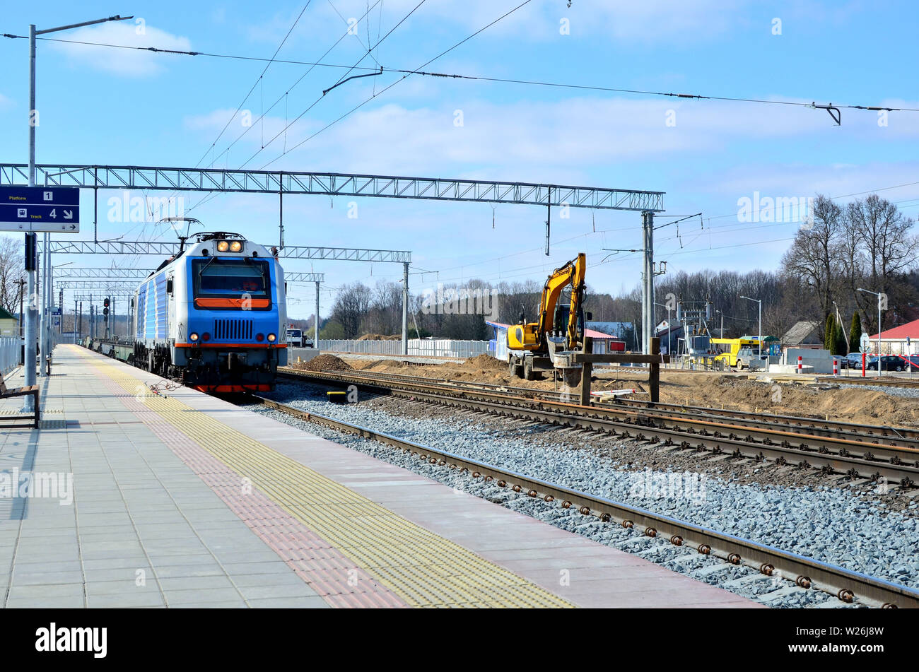 Freight train at the railway station on the background of the ...