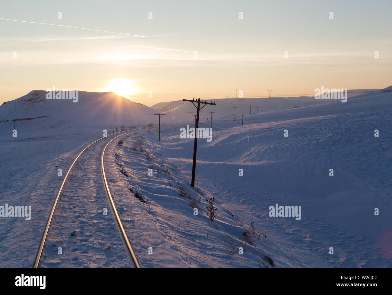 Snowy railway, sunset, background Stock Photo - Alamy