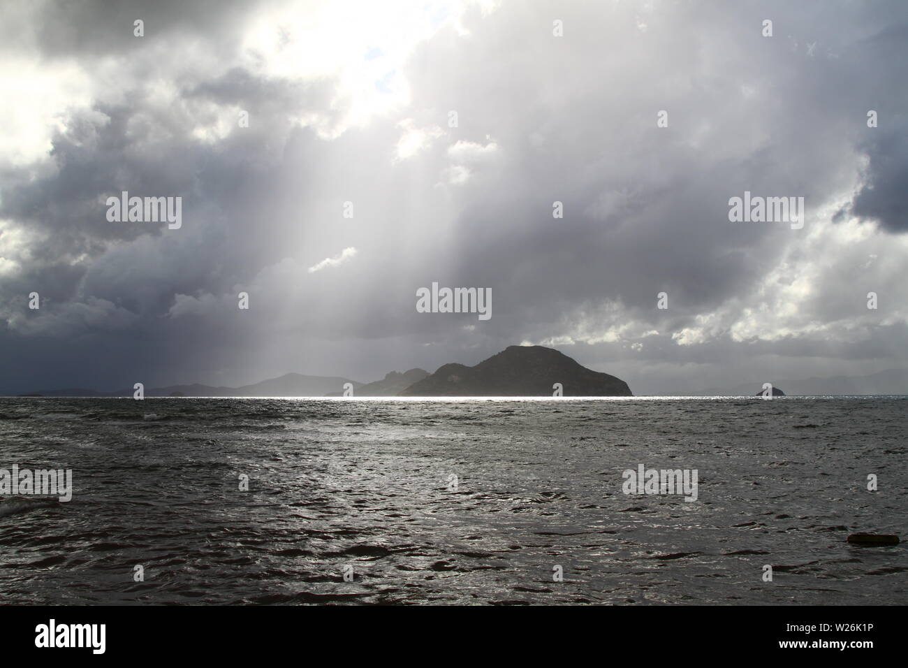 Heavy, storm clouds over the ocean, herald the arrival of a storm ...