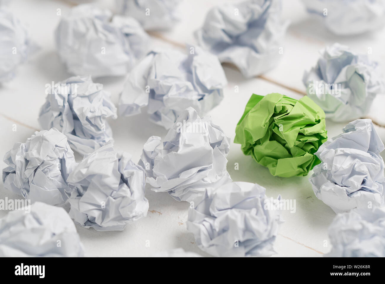 crumpled paper symbolizing different solutions with one standing out ...