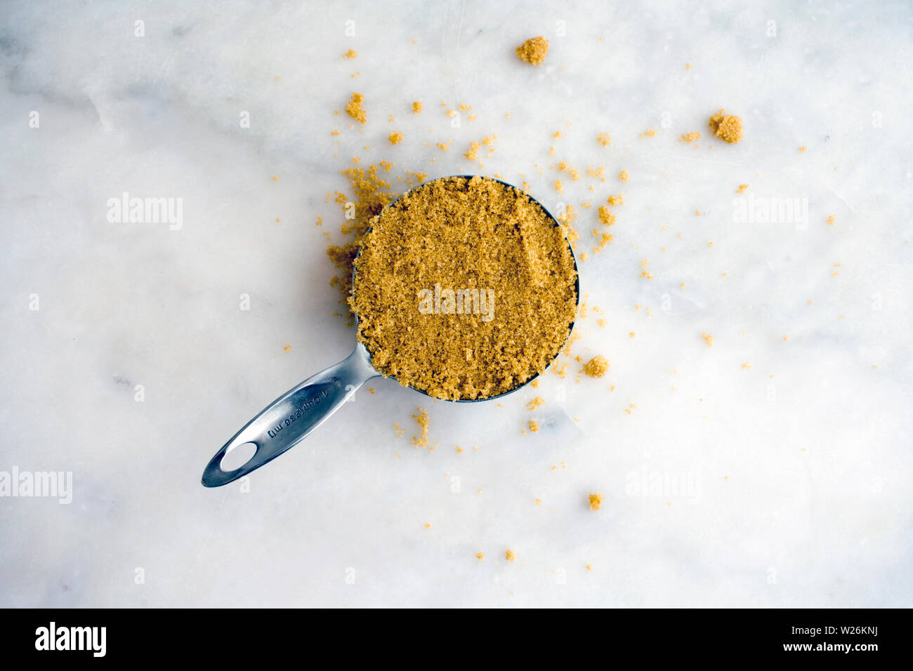 Packed Brown Sugar in a Measuring Cup Stock Photo - Alamy