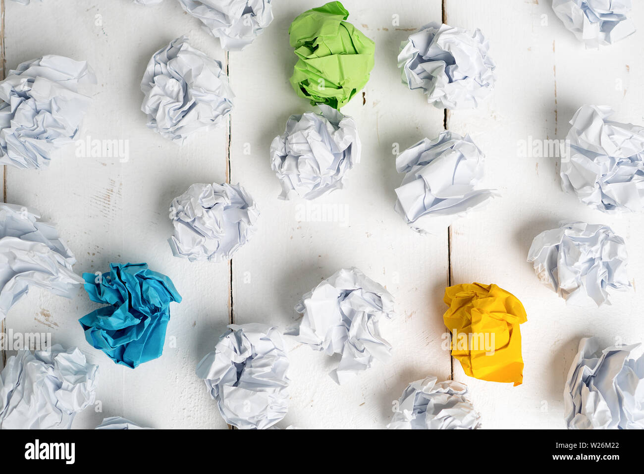 crumpled paper symbolizing different solutions with some standing out ...