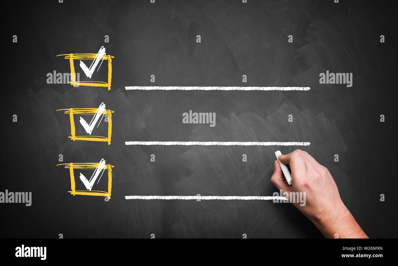 checklist on a chalkboard Stock Photo - Alamy